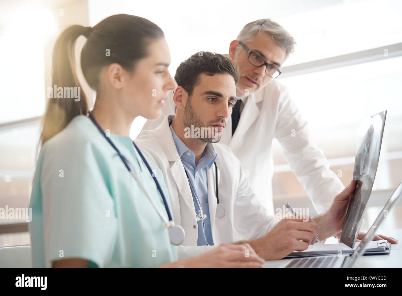 Medical team checking Xray results Stock Photo - Alamy