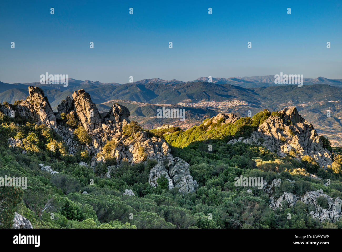 Town of Orgosolo, Monti del Gennargentu in far distance, view from road ...