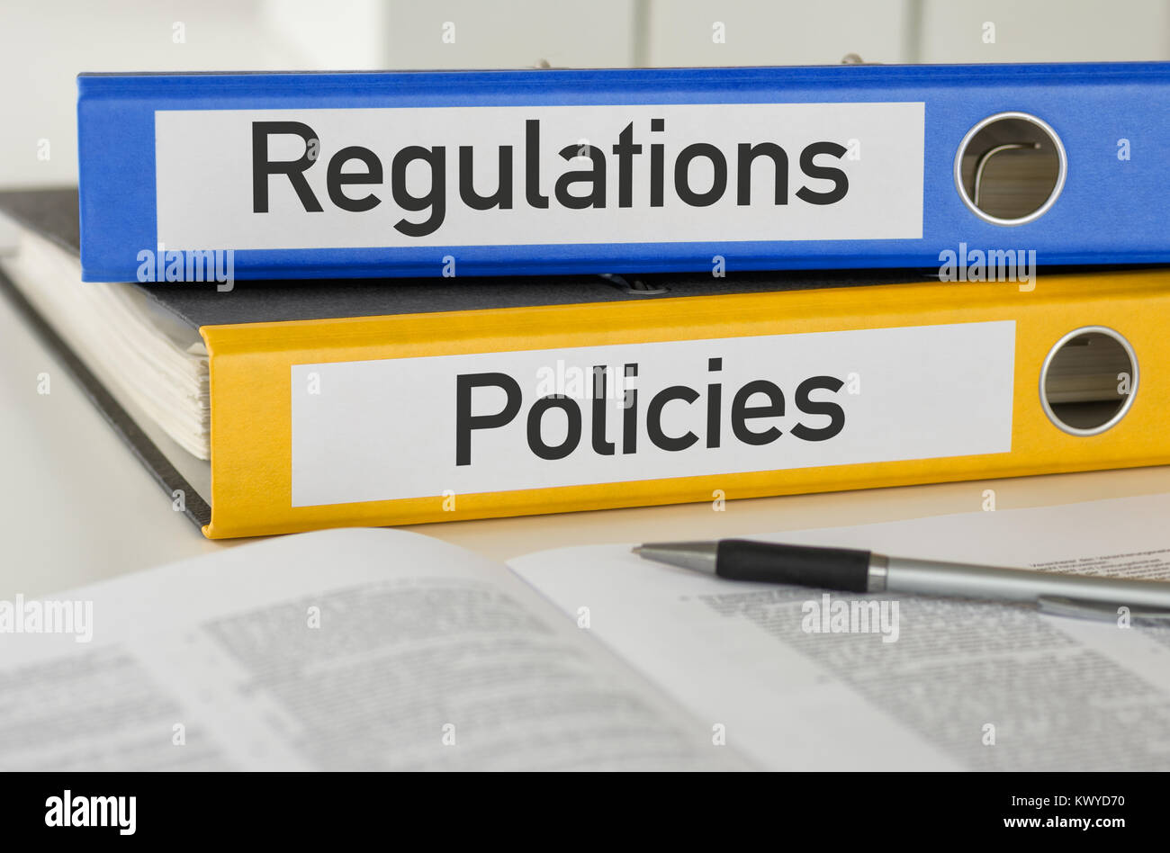 Folders with the label Regulations and Policies Stock Photo - Alamy