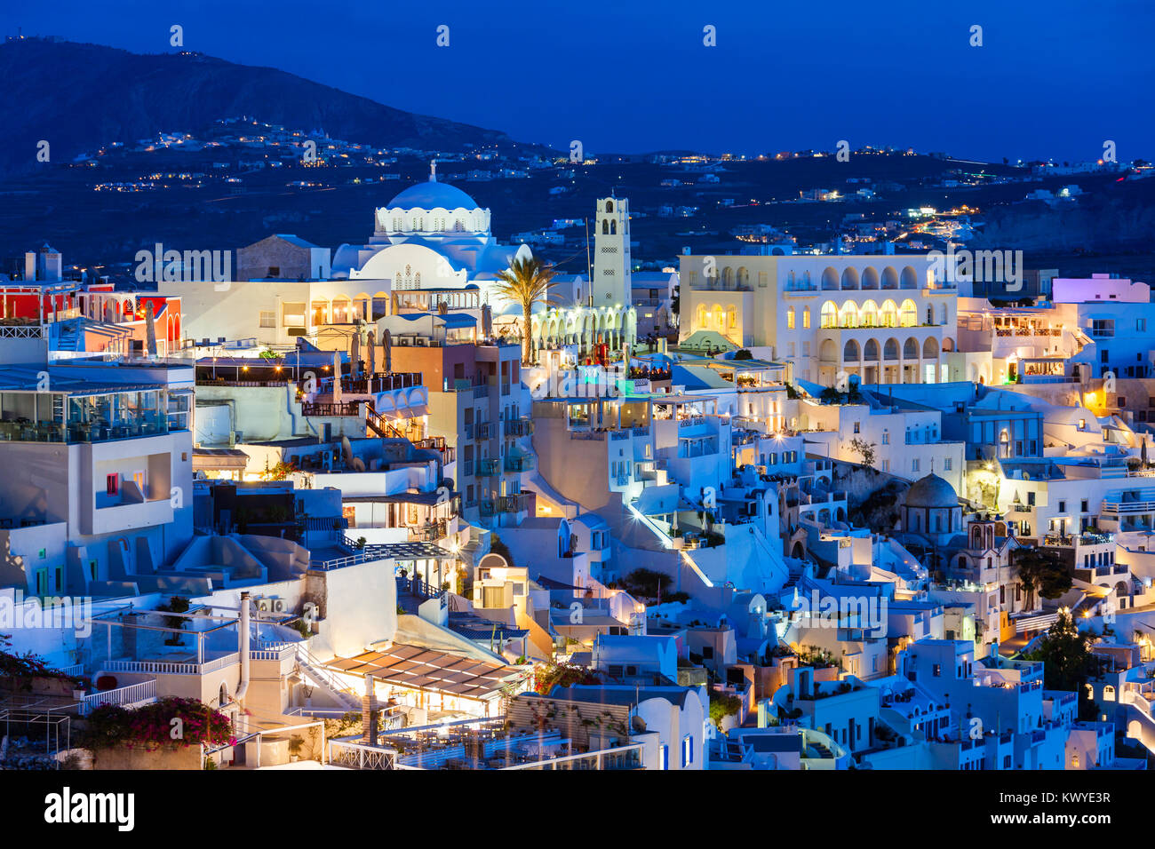 Fira town aerial panoramic view, Santorini at sunset. Fira is the ...