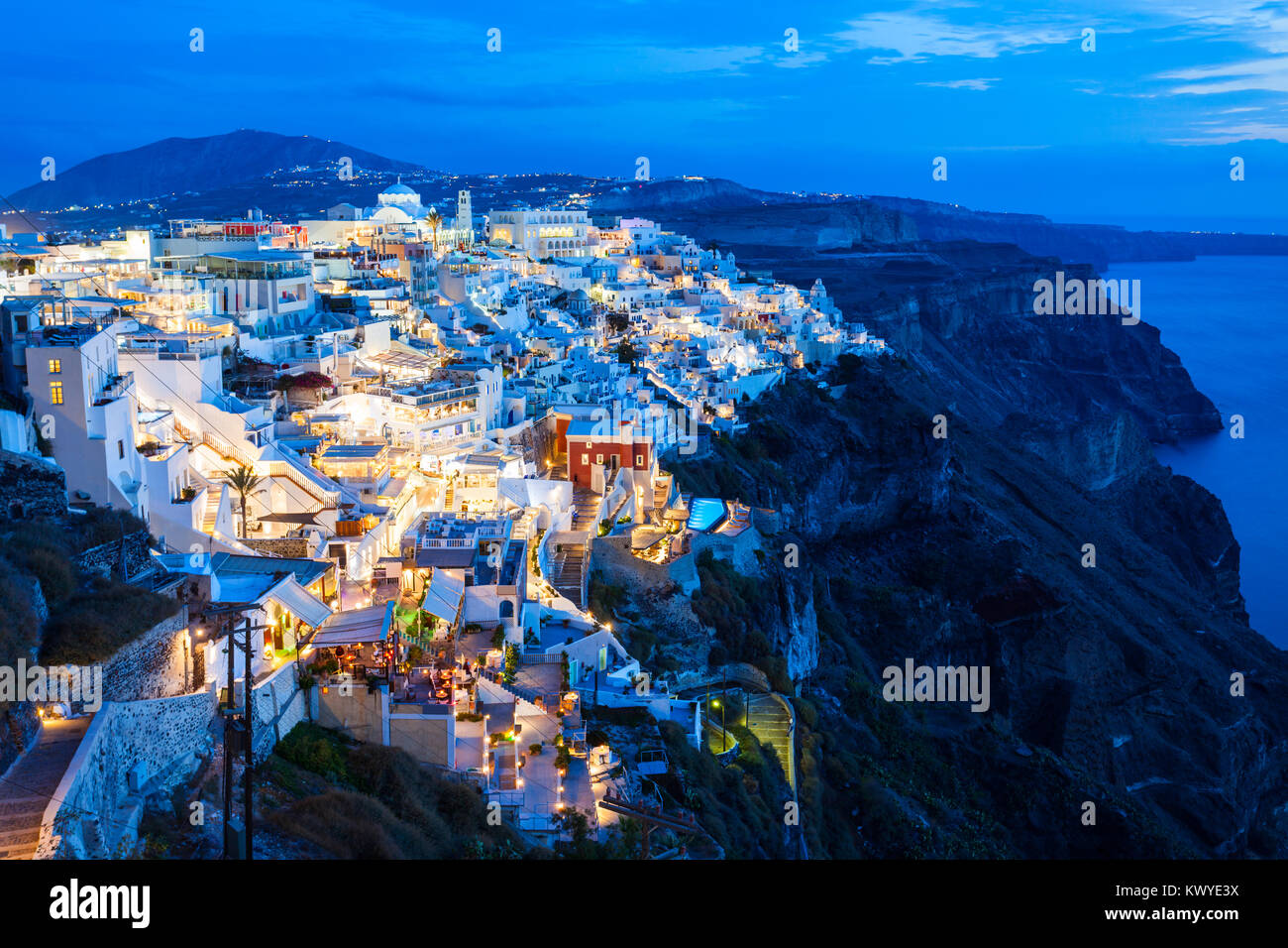 Fira town aerial panoramic view, Santorini at sunset. Fira is the ...