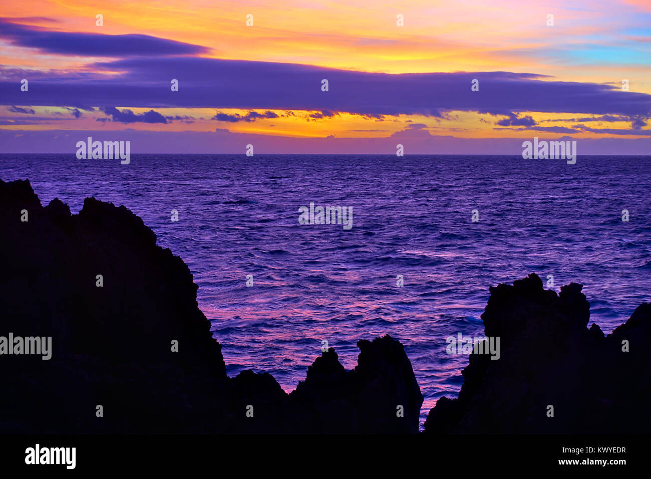 Beautiful sundown over Atlantic Ocean and silhouette of rocks on the ...