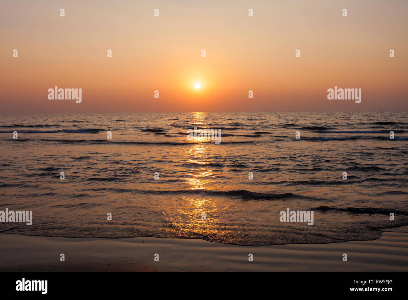 Beauty sunset on Goa beach in India Stock Photo - Alamy