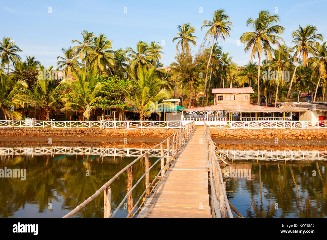 Bridge through small river on Mandrem beach in north Goa, India Stock ...