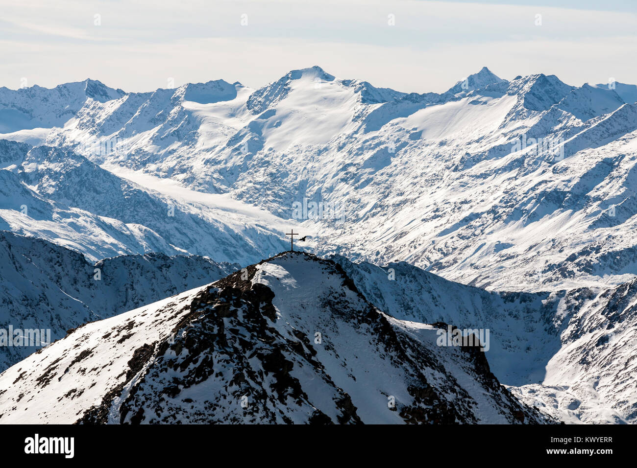 Cross and the raven over it on the Alps mountains, Austria, Stubai ...