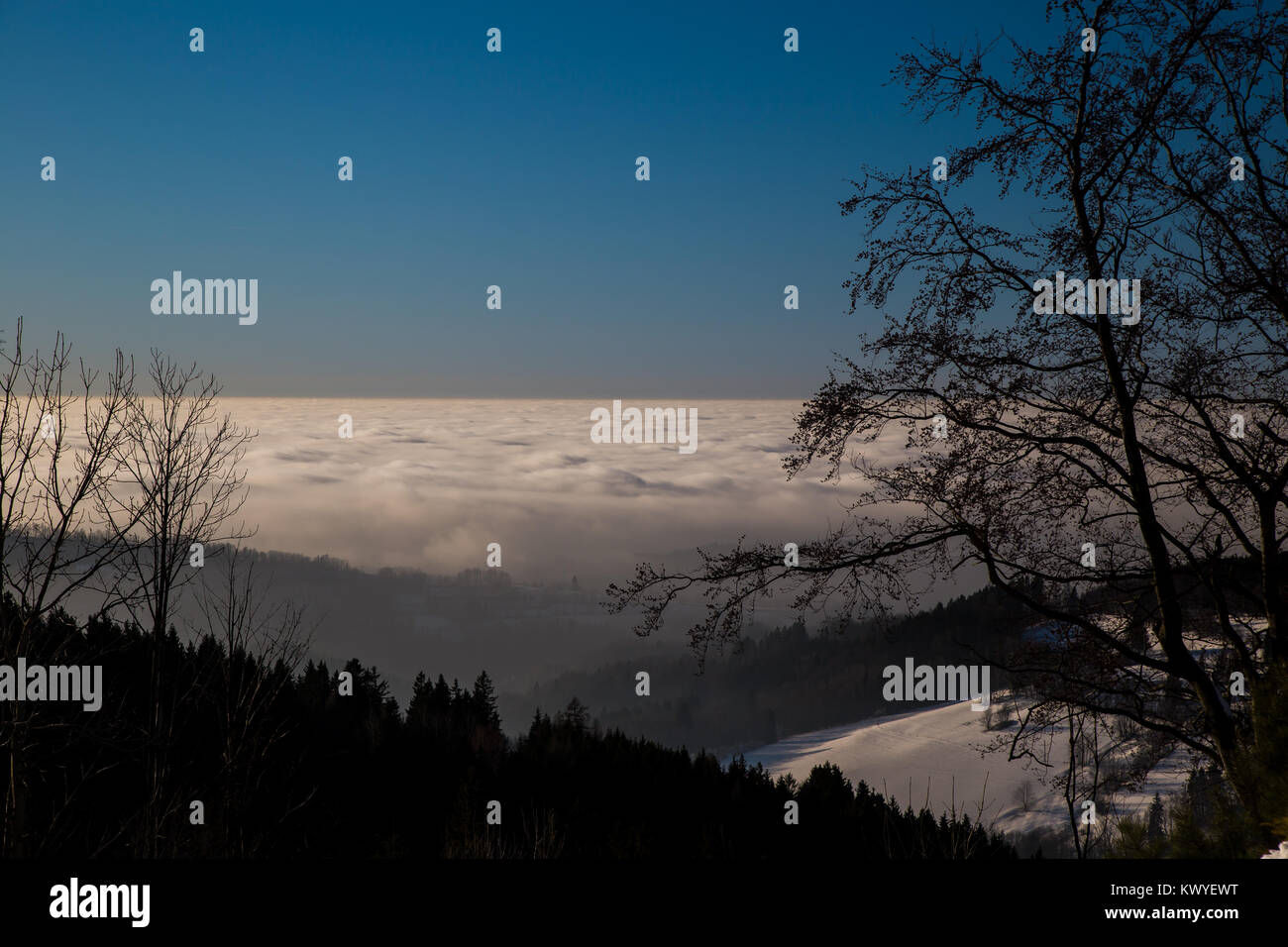 inverse clouds below mountain peaks Stock Photo - Alamy