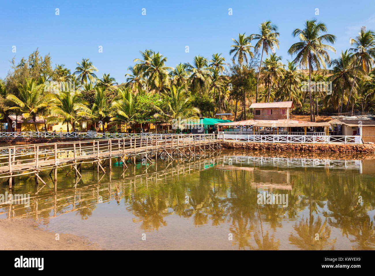 Bridge through small river on Mandrem beach in north Goa, India Stock ...