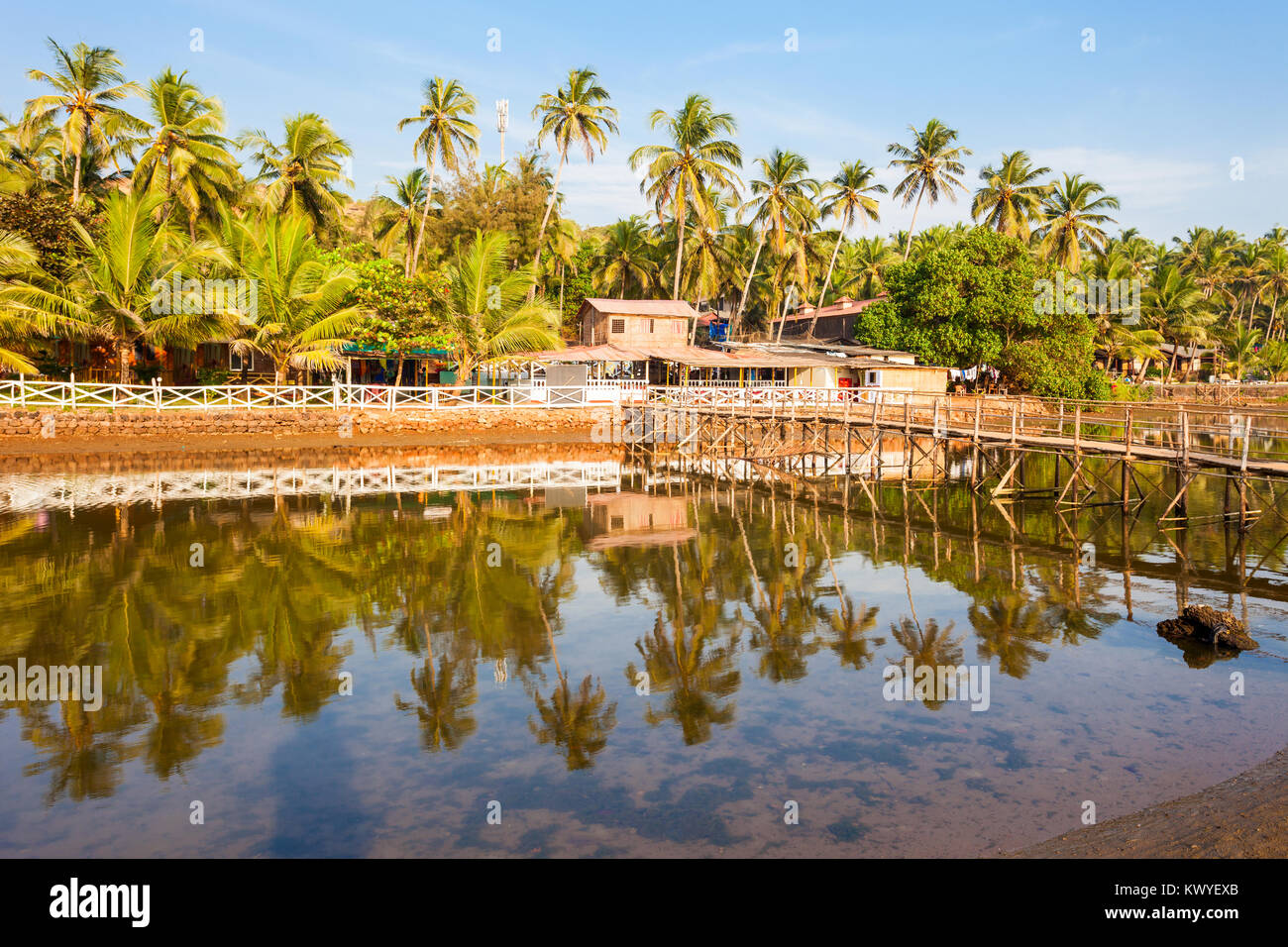 Bridge through small river on Mandrem beach in north Goa, India Stock ...