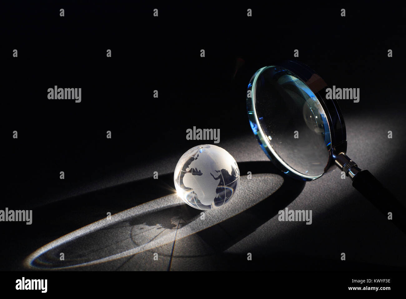 Magnifying glass examining earth hi-res stock photography and images ...