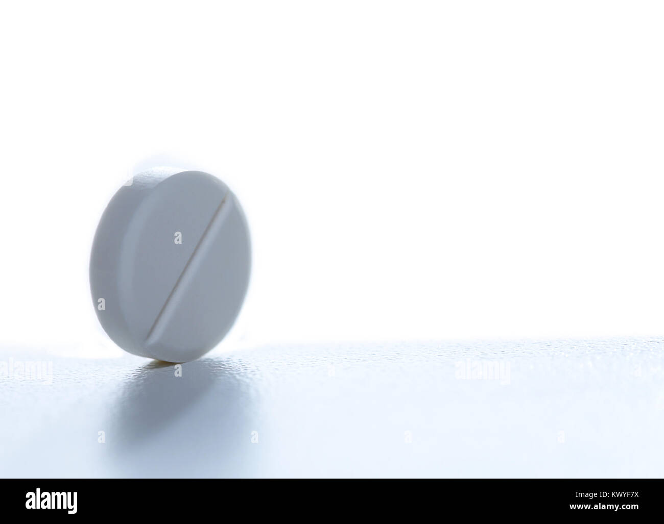 One pill standing vertical on white background with copy space Stock ...