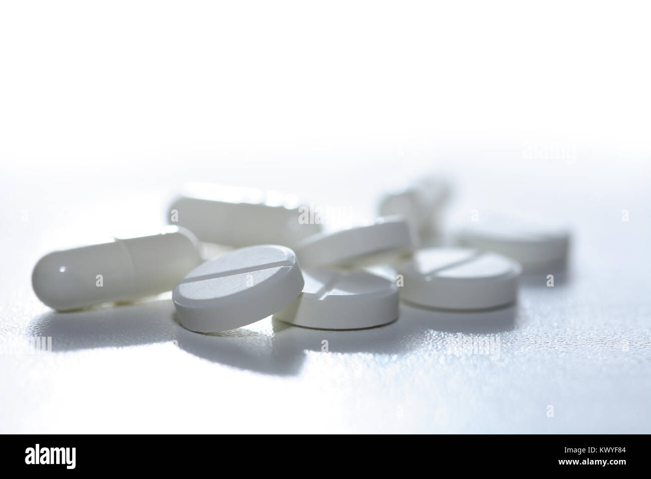Extreme closeup of few pills on white background with copy space Stock ...
