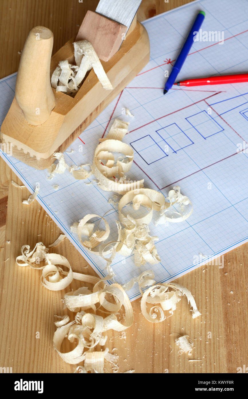 Old wood planer and sheet of graph paper on wooden background Stock ...