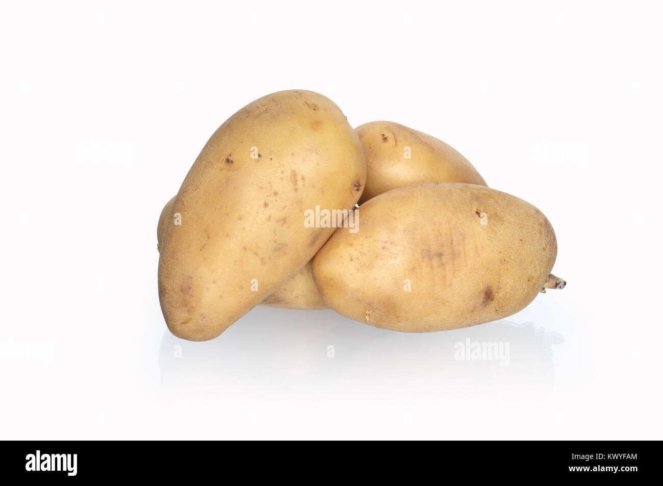 Few raw potatoes isolated on white background with clipping path Stock ...