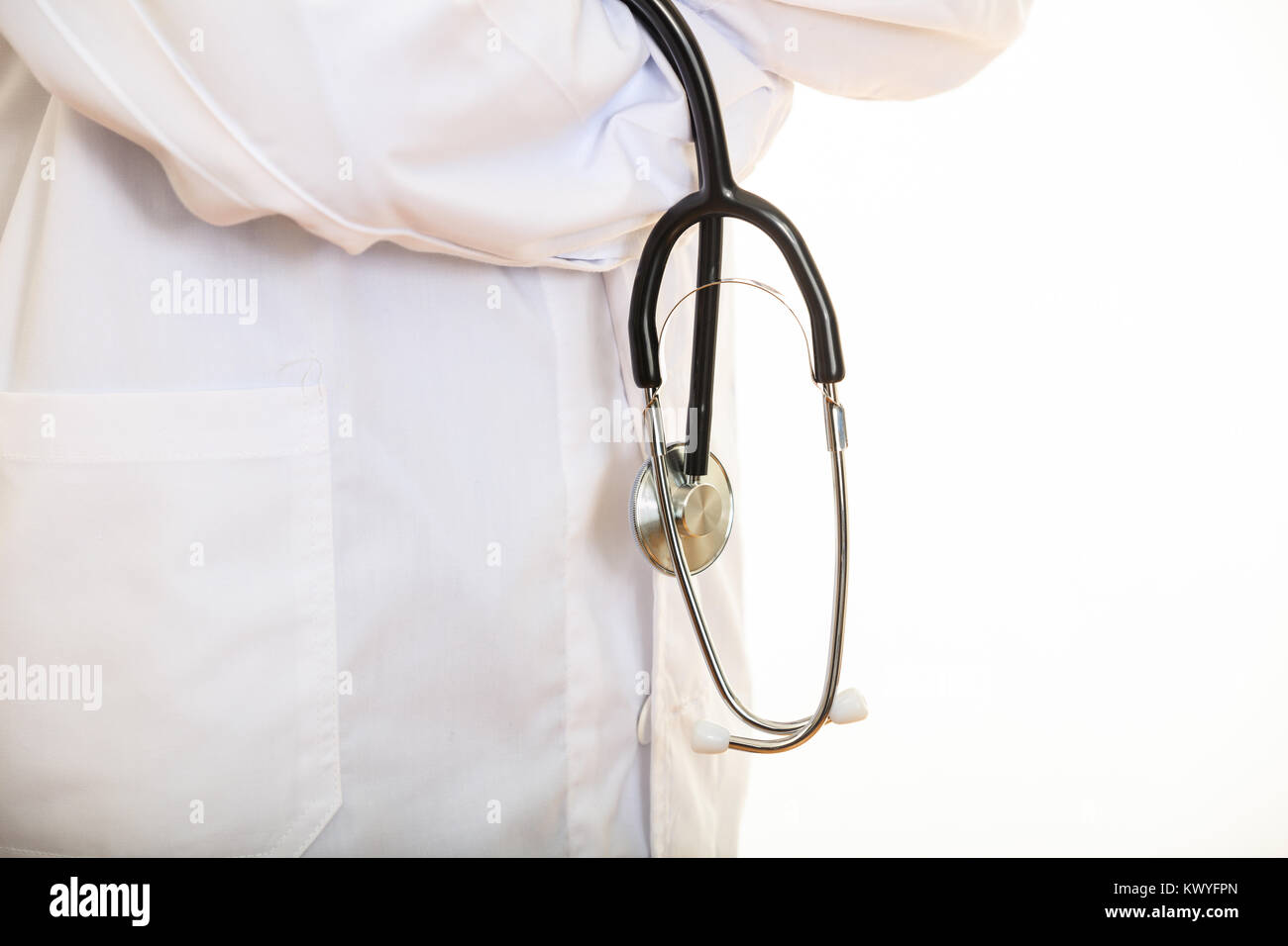 Doctor with a stethoscope standing on white background Stock Photo - Alamy