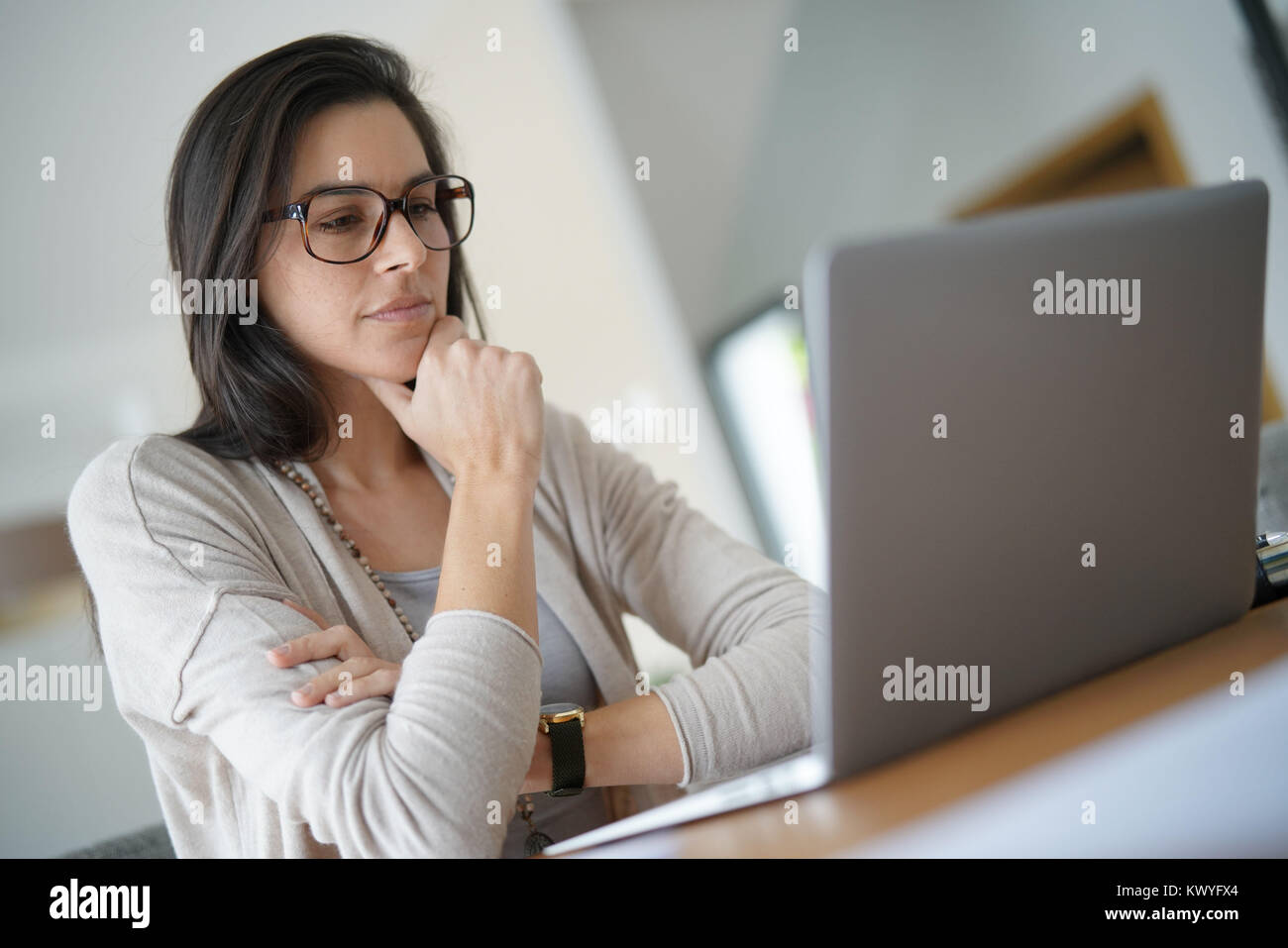 Woman working from home on laptop computer Stock Photo - Alamy