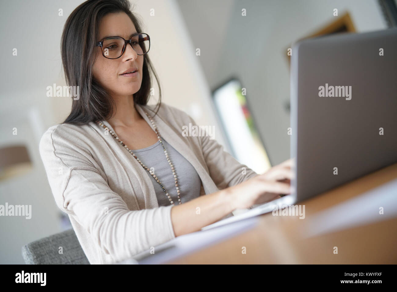 Woman working from home on laptop computer Stock Photo - Alamy