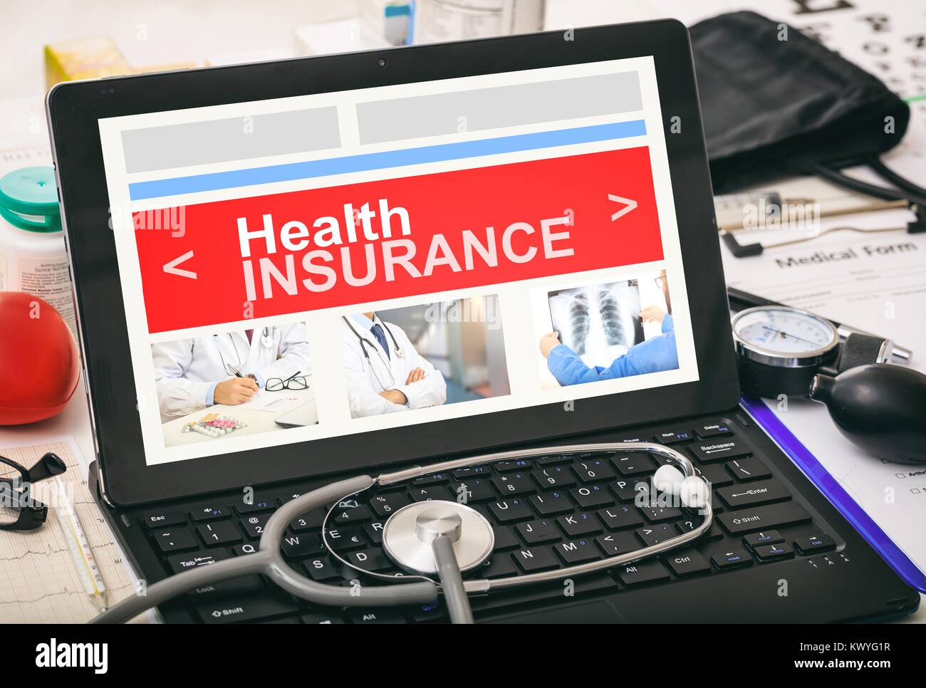 Health insurance on a computer's screen on a desk Stock Photo - Alamy