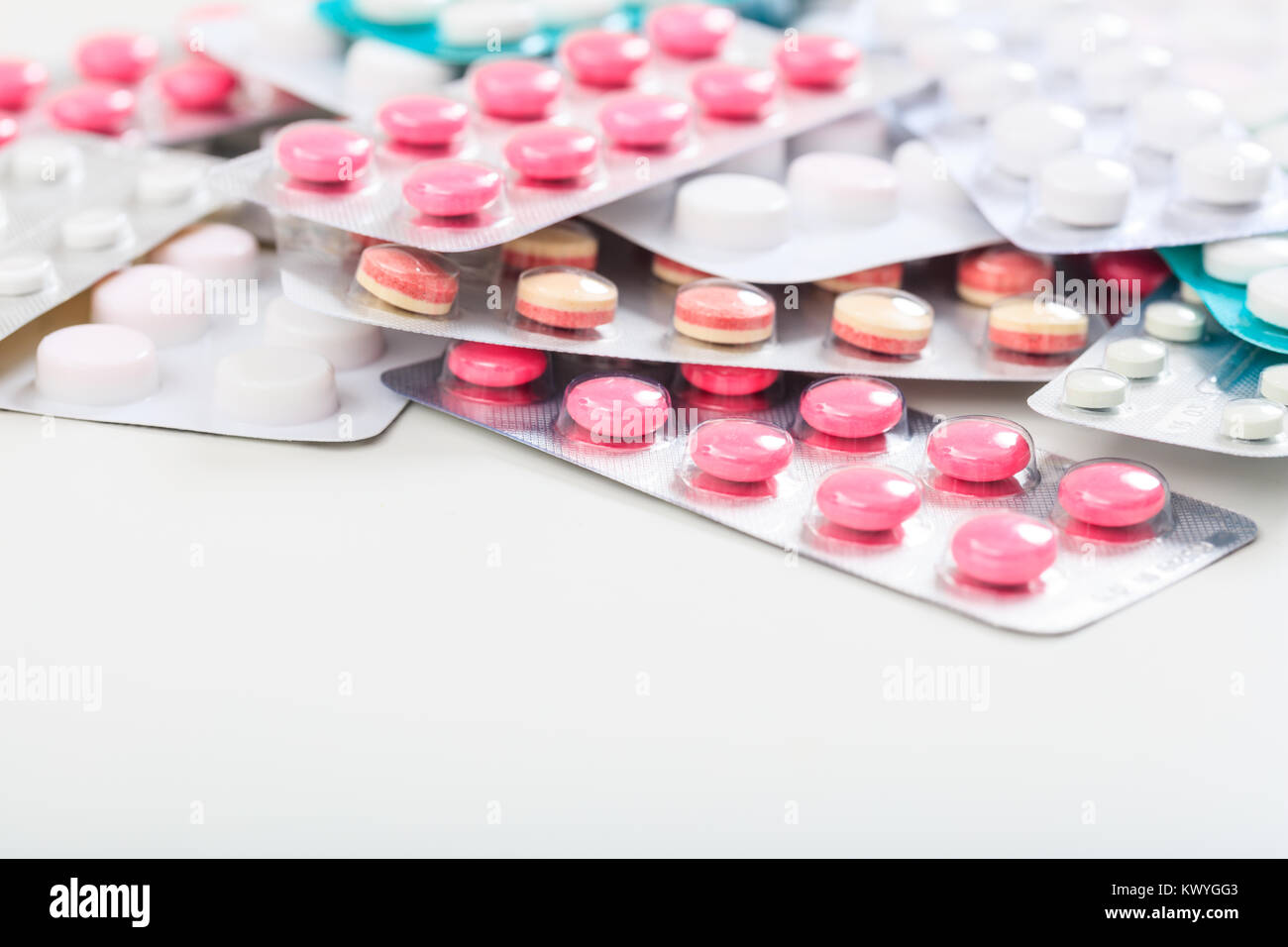 Stack of colorful pills on white background Stock Photo - Alamy