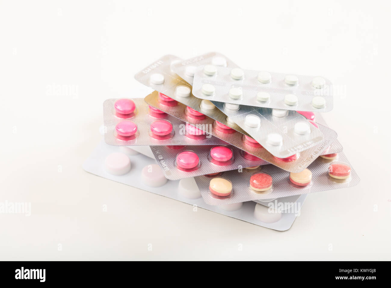 Stack of colorful pills on white background Stock Photo - Alamy