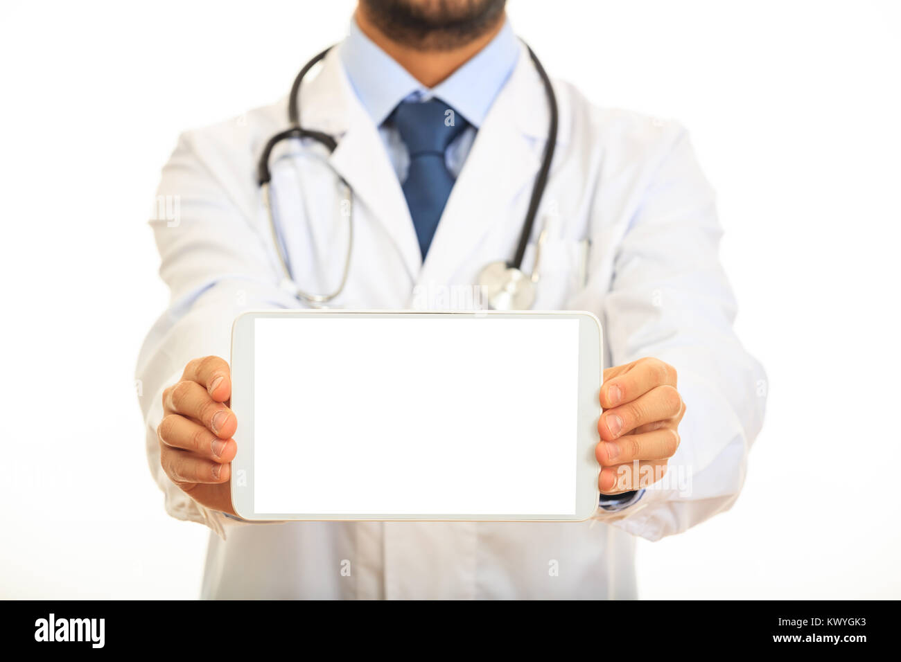 Doctor presenting a tablet on white background Stock Photo - Alamy