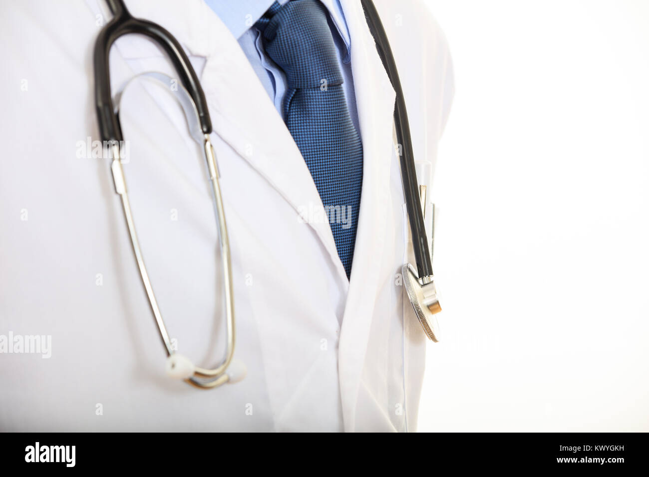 Doctor with a stethoscope standing on white background Stock Photo - Alamy