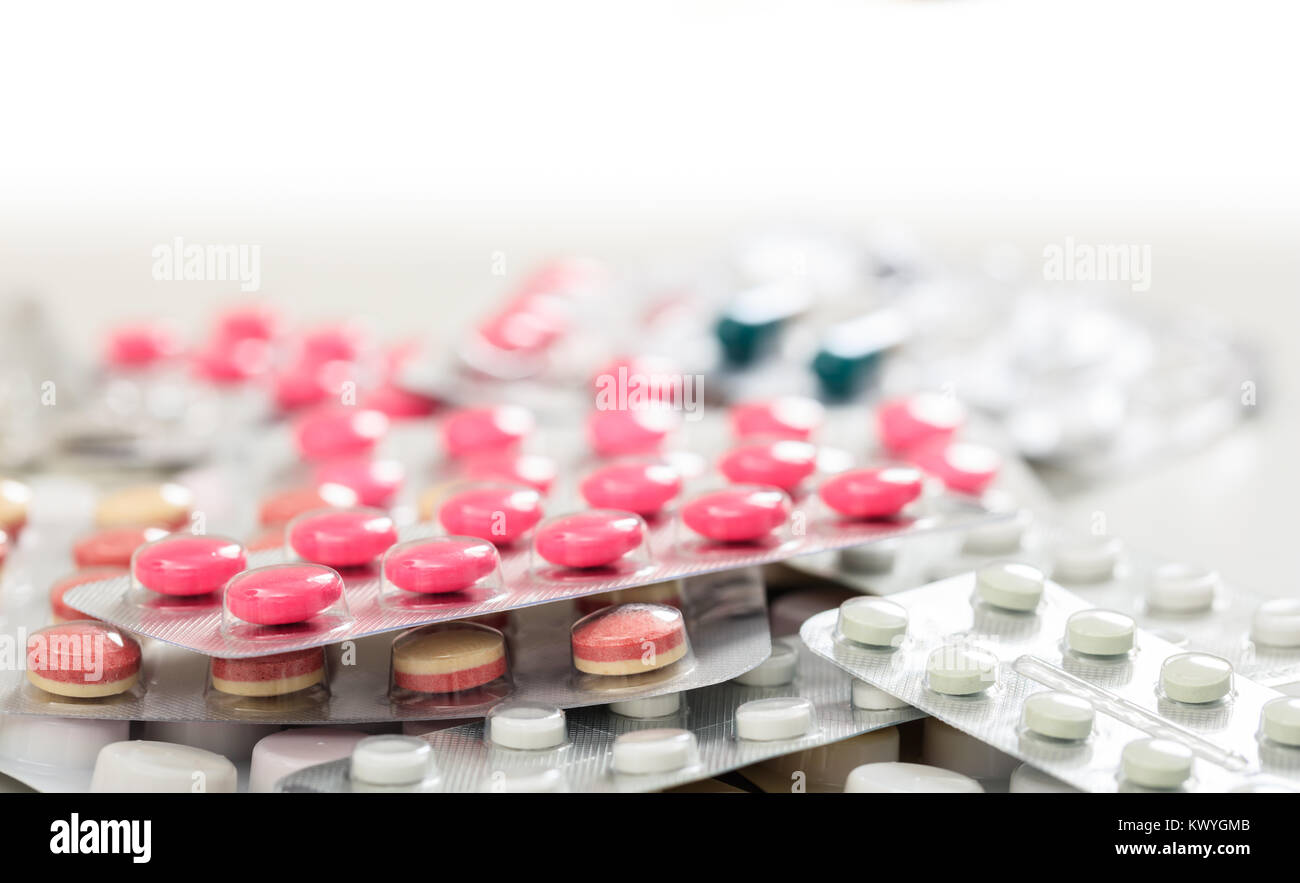 Stack of colorful pills on white background Stock Photo - Alamy