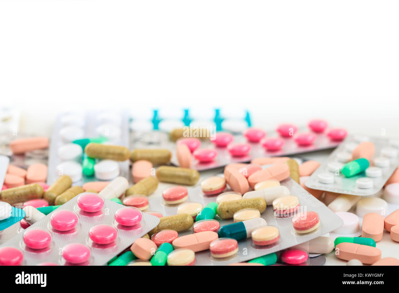 Stack of colorful pills on white background Stock Photo - Alamy