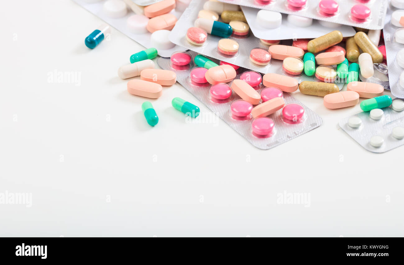Stack of colorful pills on white background Stock Photo - Alamy