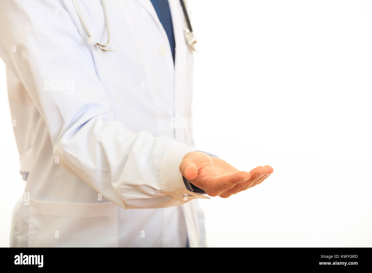 Doctor offering a hand standing on white background Stock Photo - Alamy