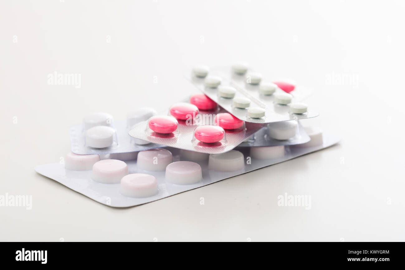 Stack of colorful pills on white background Stock Photo - Alamy