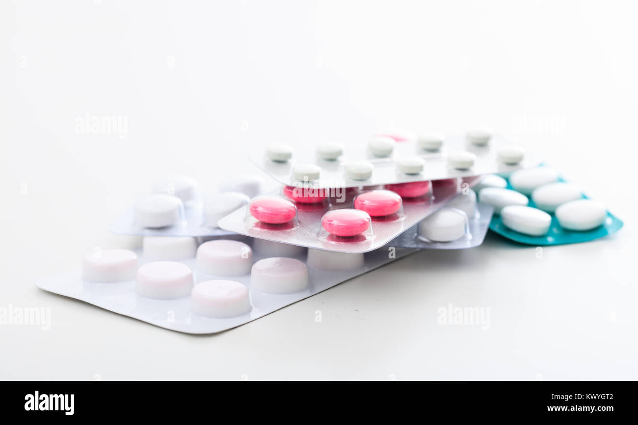 Stack of colorful pills on white background Stock Photo - Alamy