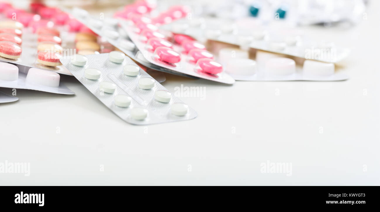 Stack of colorful pills on white background Stock Photo - Alamy