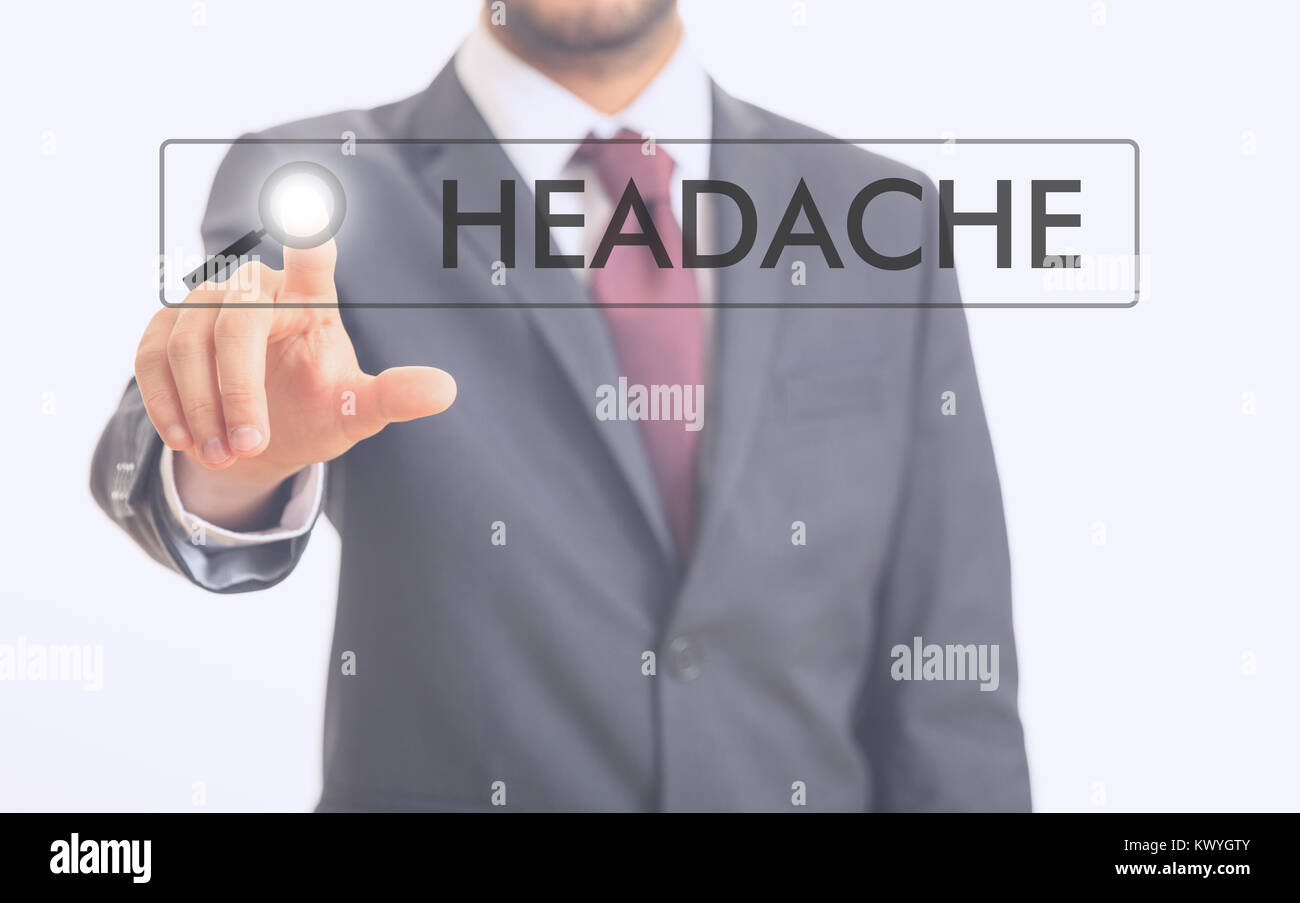 Man pointing at word headache on white background Stock Photo - Alamy