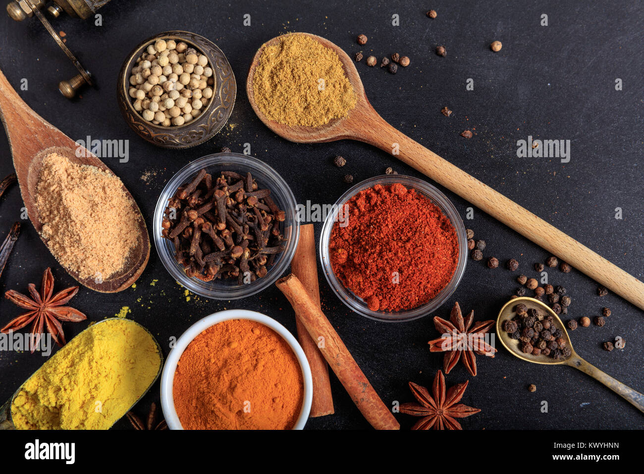 Variety of colorful spices, black background Stock Photo - Alamy