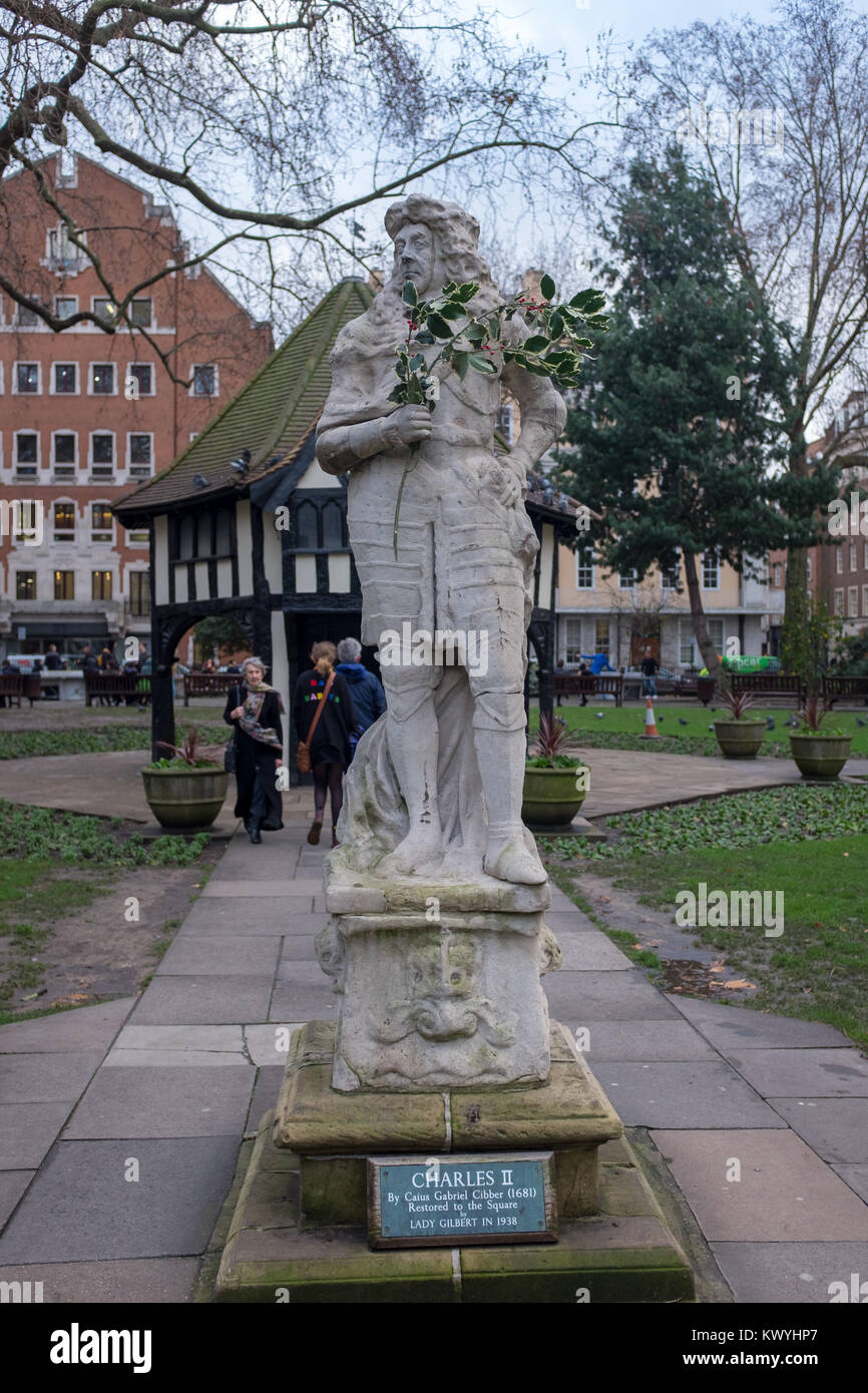 A statue of Charles II in Soho Square, London, holding a sprig of Holly ...