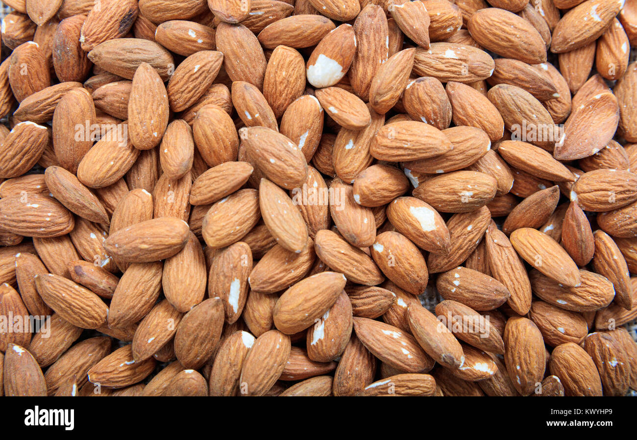 Dried almonds as full background Stock Photo - Alamy