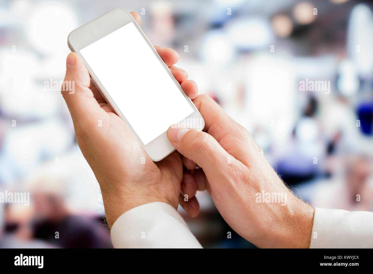 Businessman holding blank screen smartphone in office Stock Photo - Alamy