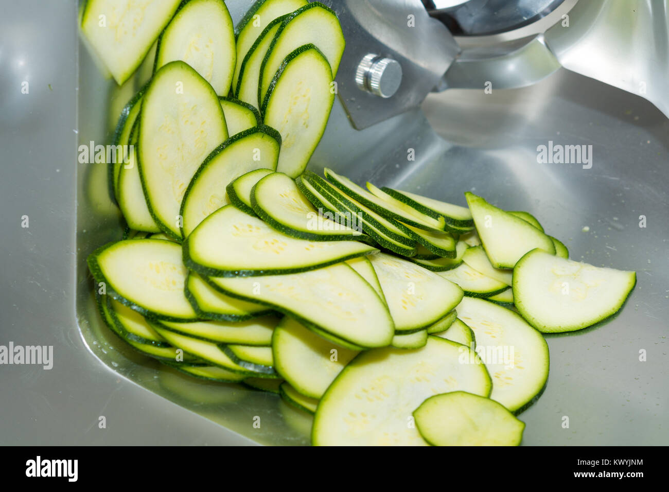 fresh zucchini cut ready for pizza. zucchini cut with slicer Stock ...