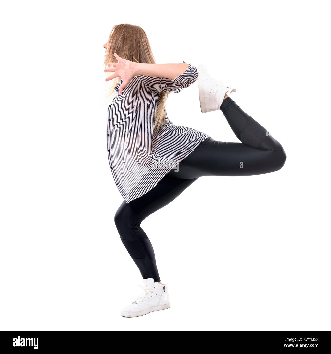 Side view of flexible female jazz dancer performance on one leg with ...