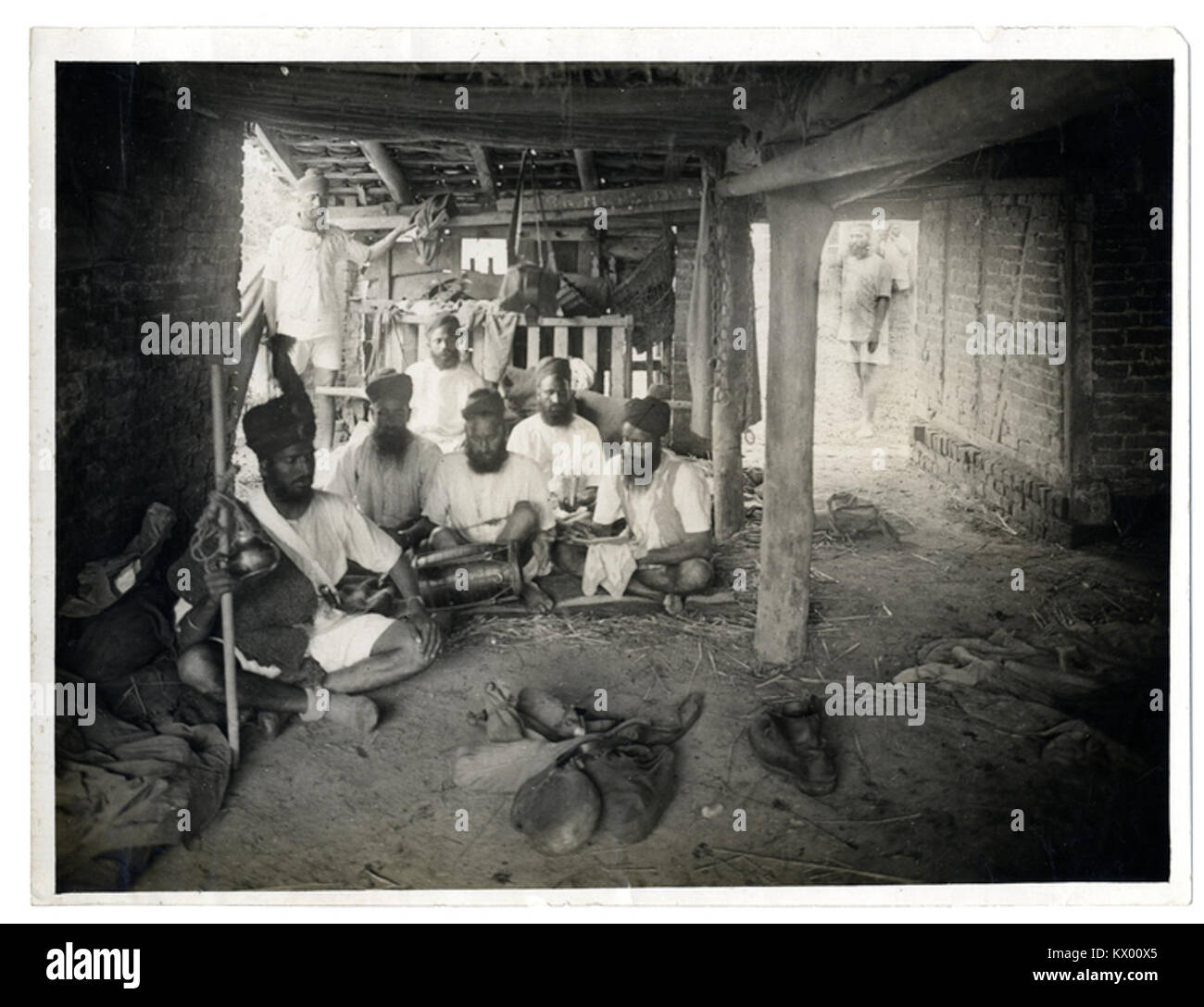 This photograph captures Sikhs singing religious chants in a French ...