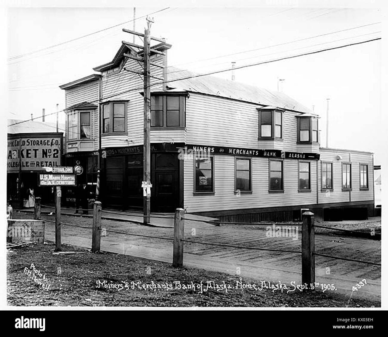 The image showcases the Miners and Merchants Bank building in Nome ...