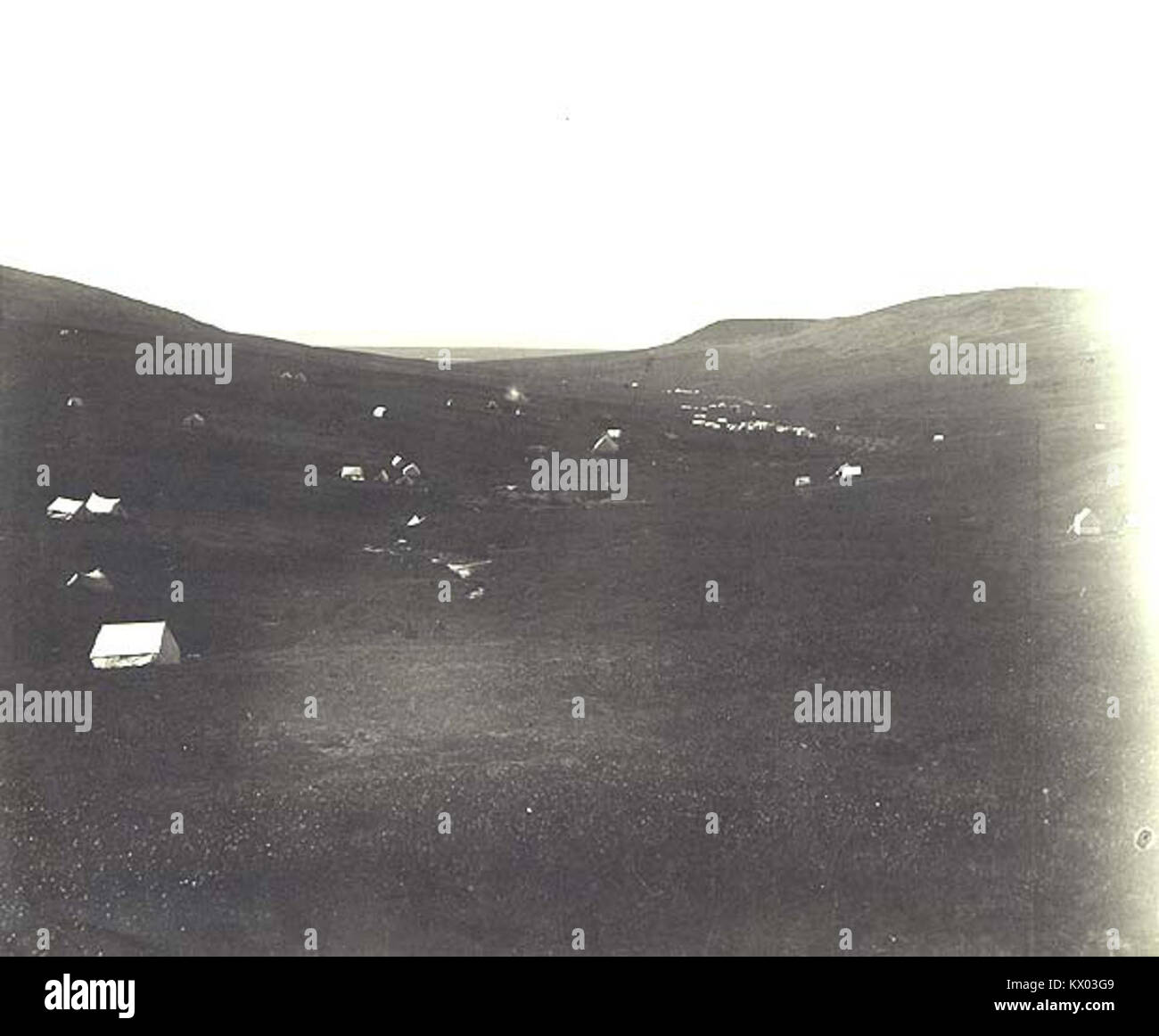 This photograph shows mining camps with tents in the vicinity of Nome ...