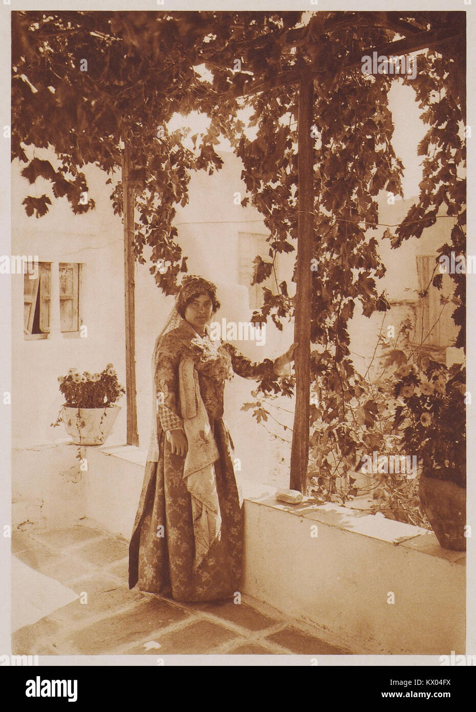 This photograph shows the traditional costume of women from Nios ...