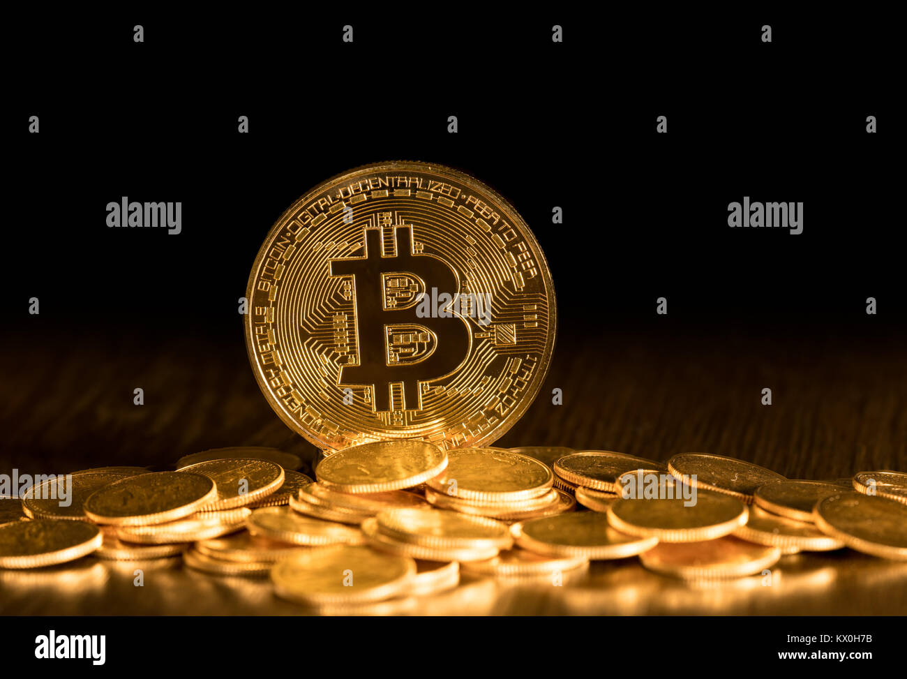 Stack of bitcoins with gold background Stock Photo - Alamy