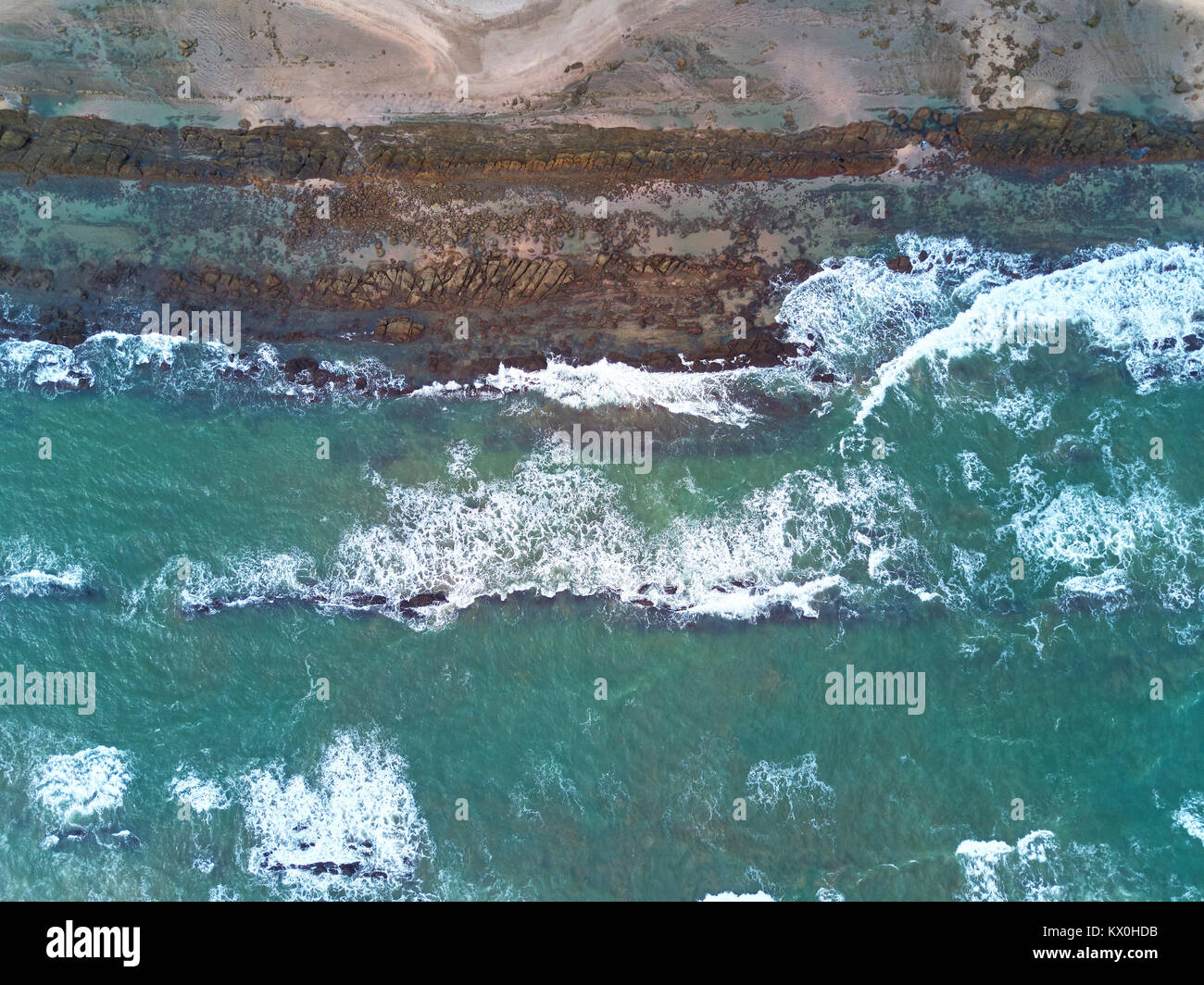Aerial shot waves hit rocks hi-res stock photography and images - Alamy
