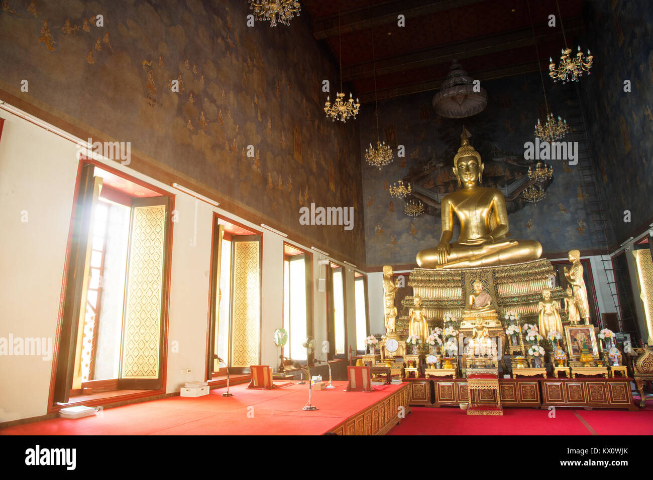 Main seated golden Buddha in Wat Rat Natda Ram Worawihan Monastery or ...