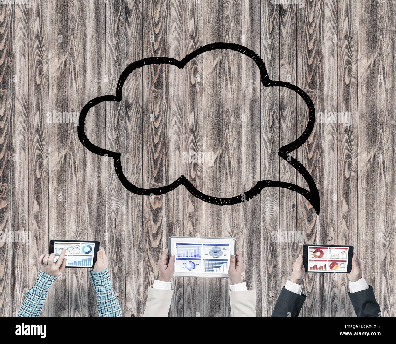 Group of people with devices in hands working together as symbol of ...