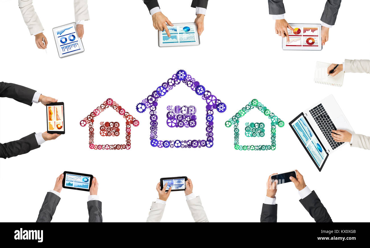 Group of people with devices in hands working together as symbol of ...