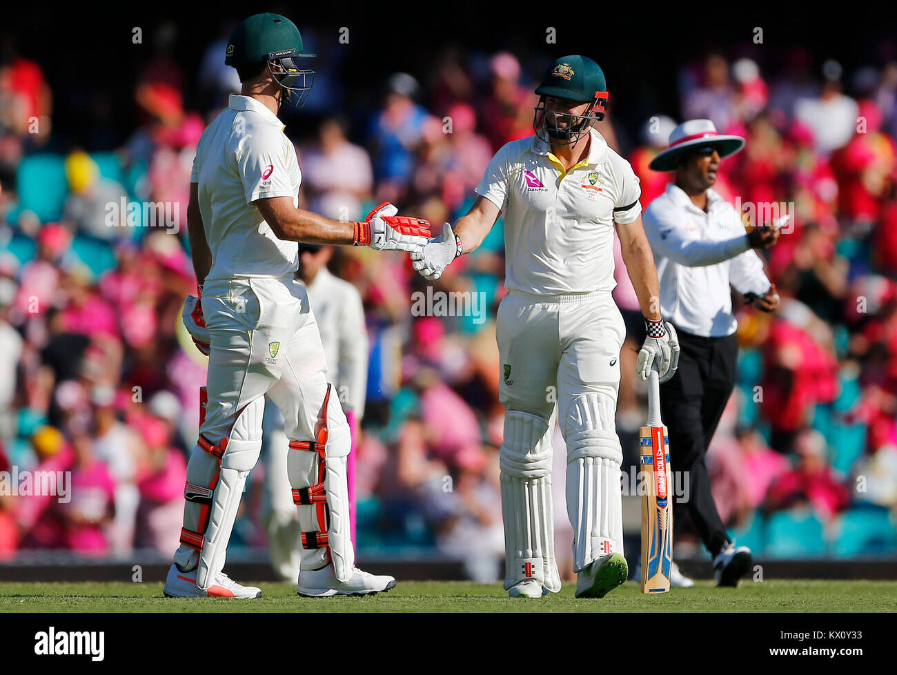 Australia's Shaun Marsh walks off with his brother Mitchell at the end ...