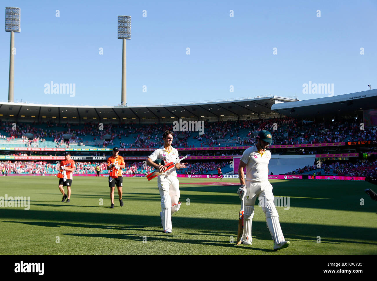 Australia's Shaun Marsh walks off with his brother Mitchell at the end ...